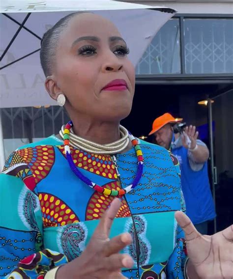 Download Mature South African Woman Colorful Necklace Wallpaper