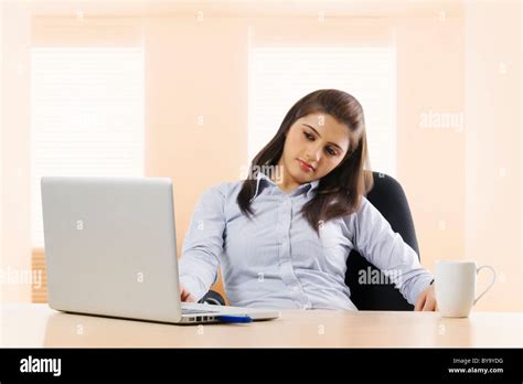 Businesswoman Feeling Lazy At Work Stock Photo Royalty Free Image Alamy