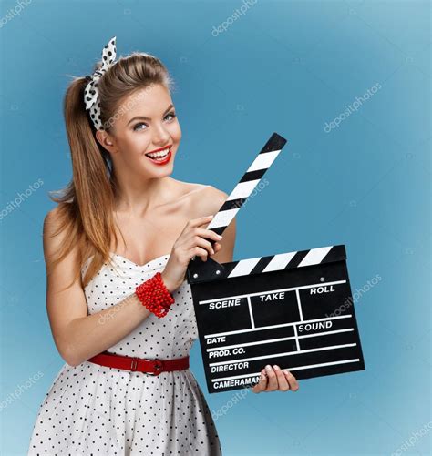 Sexy Pin Up Girl Holding A Clapper Board Filmmaking Or Film Production Concept Stock Photo