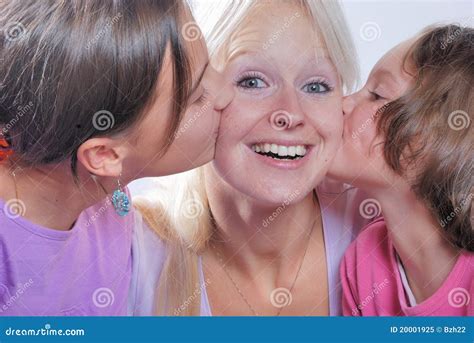 A Mother Smiles As She Receives A Kiss Stock Image Image Of Sibling