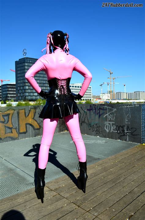 Rubber Doll Posing Posing Outside In Boots Catsuit Tutu Corset