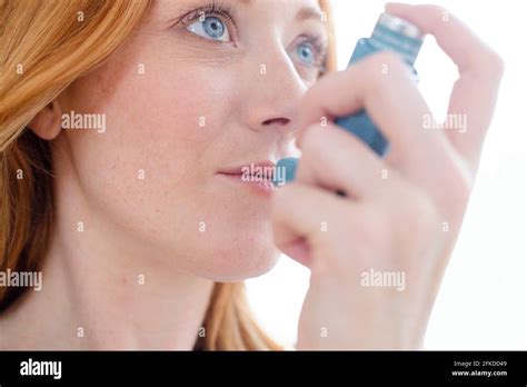 Woman Using Inhaler Stock Photo Alamy