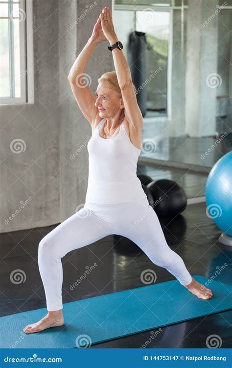 Senior Woman Doing Yoga In Fitness Gym Aged Lady Exercising Old