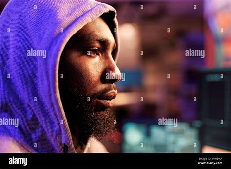 African American Hacker In Hood Breaking Into Computer Network System And Hacking Server Young