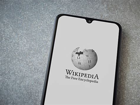 The Launch Screen Of Wikipedia App Featuring Black Display With The