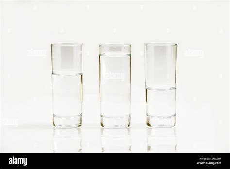 Water In Three Glasses Different Level Isolated Over A White