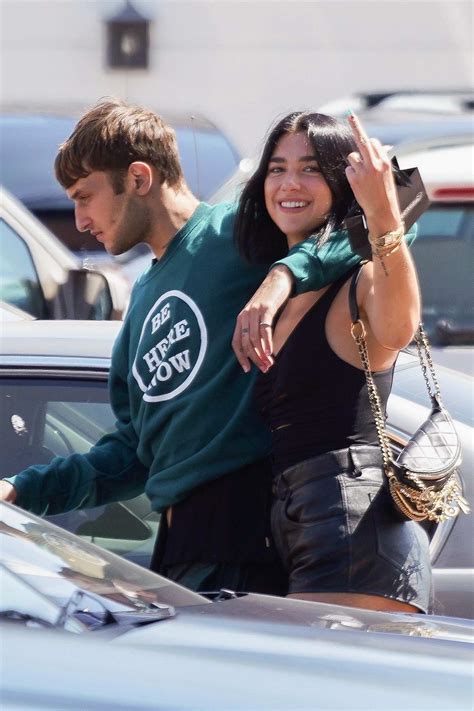 Dua Lipa Flaunts Her Legs In A Cheeky Leather Shorts As She Packs On