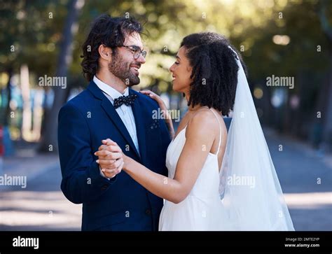 Interracial Wedding Couple And Dancing In Street With Excited Smile