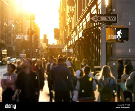 Crowd Of Anonymous People Walking Down The Busy Sidewalk On 23rd Street