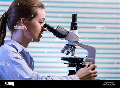 Beautiful Science Student Looking Into A Microscope In A Laboratory Stock Photo Alamy