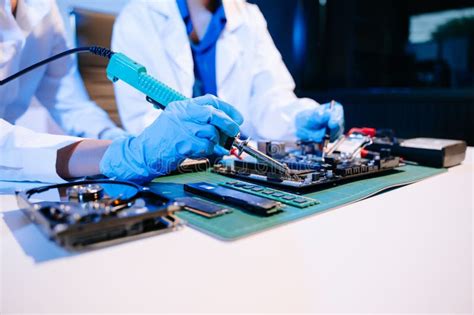 The Technician Is Putting The Cpu On The Socket Of The Computer Motherboard Electronic