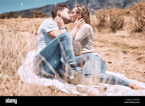 Kissing In Love And Young Couple On Picnic Valentine Date Outdoors In