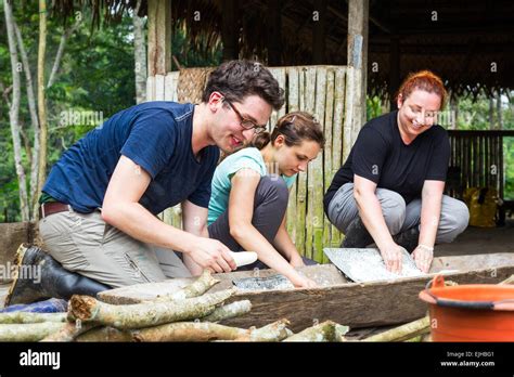 Tourist Preparing Cassava Pie Cassava Root Are Grinded Using
