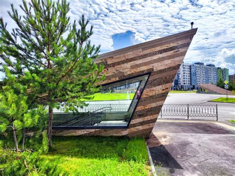 Modern Architectural Design Of A Unique Building With Angular Structure Surrounded By Greenery