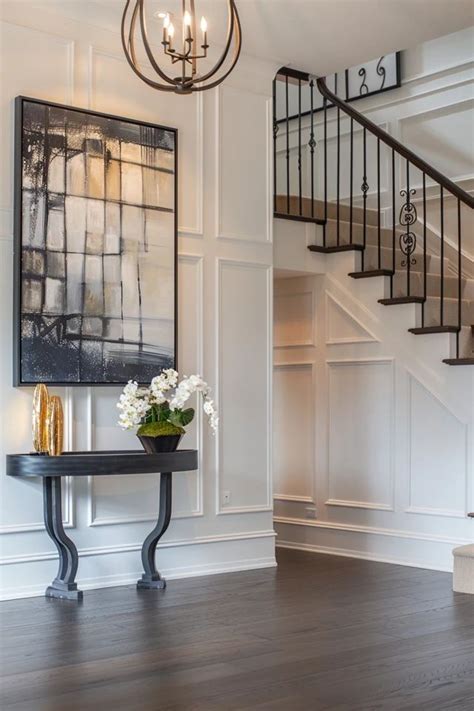 Elevate Your Entryway With Two Story Foyer Wall Decor Ideas Two Story Entryway Decorating