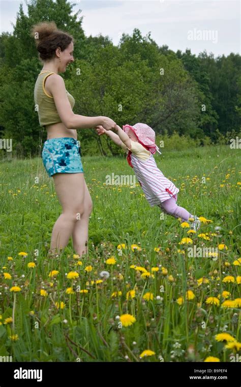 Mother Rotate Baby Stock Photo Alamy