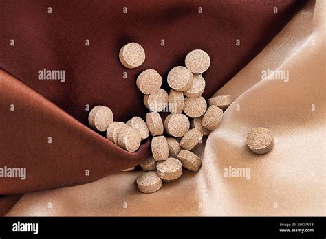 Dgl Licorice Root Extract Chewable Tablets On Silk Background Immune Prevention Care Concept