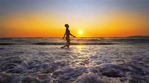 Brunette Woman With Perfect Body Running On The Beach Stock Image