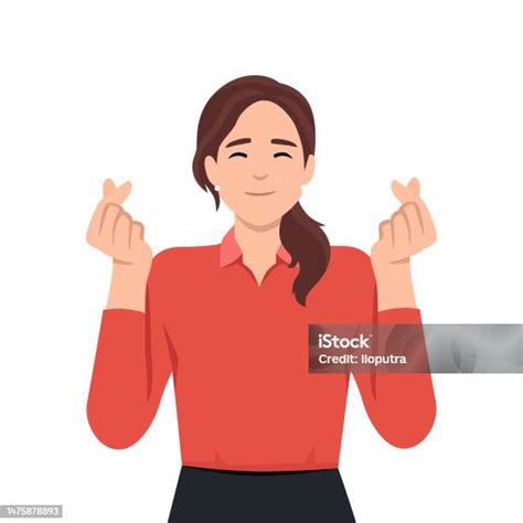 웃는 여자는 심장 모양으로 두 손가락을 교차시키고 표시는 사랑을 표현합니다 한국의 마음 제스처 사랑과 행복 개념 감정에 대한