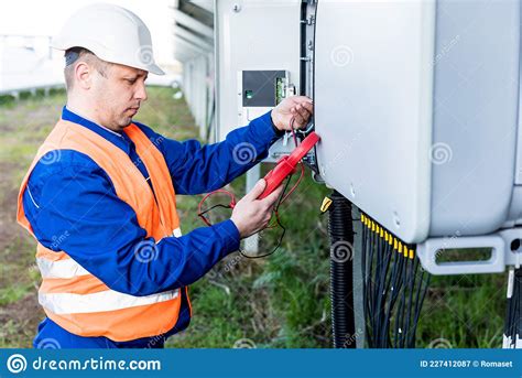 The Inspector Checks The Actual Output Voltage Level Of Inverter Stock Image Image Of Business