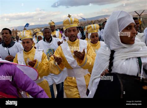Eritrean Christian Orthodox Worshippers Sing And Dance After A Baptism Bath In The Jordan River
