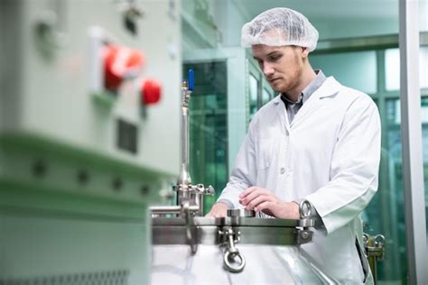Premium Photo Portrait Of A Scientist Apothecary Extracting Cannabis Oil In Laboratory