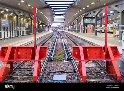 Two Train Buffer Stops In Red Installed At The End Of Platform With