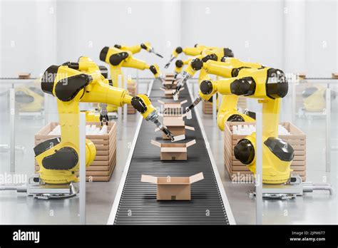 Robots At A Conveyor Belt Packing Items Into Cardboard Packages Stock