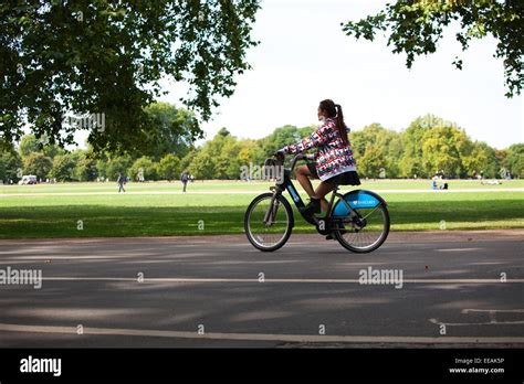Women Riding A Boris Bike At Hyde Park London Stock Photo Alamy