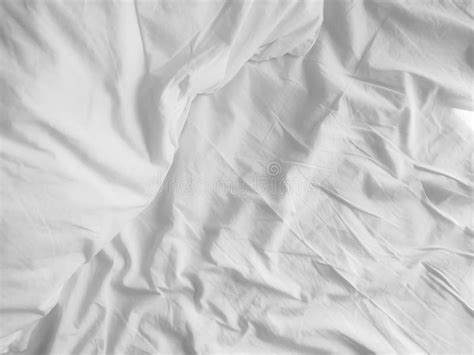 Messy White Bedding Sheet After Waking Up In The Morning Stock Image