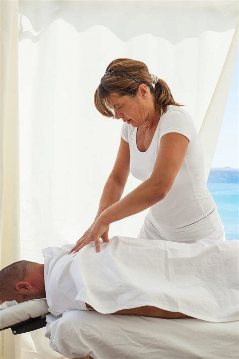Massage Treatment On The Beach By Stocksy Contributor Jelena Jojic