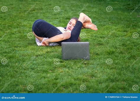 Funny Teenager Girl Trying To Practice Yoga Lesson First Time Online At