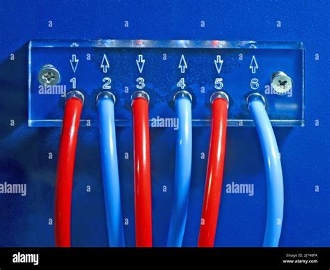 Red And Blue Connected Cables Pack Heap On Blue Surface Color Power