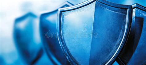 Security And Protection Concept Abstract Metallic Shields In Blurred Blue And White Stock