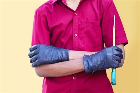 Premium Photo Mechanic In Uniform With Cross Arms And Screwdriver Isolated In White