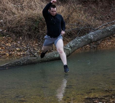 Premium Photo Full Length Of Man Jumping In River