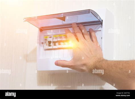 Protection Of Electrical Installation Setting The Switchboard Switch On By Hand Electric Shock
