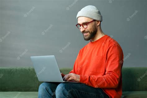 Premium Photo Programmer Using Laptop Computer Typing On Keyboard