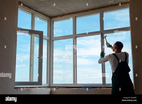 Builder Is Installing A Window Stock Photo Alamy