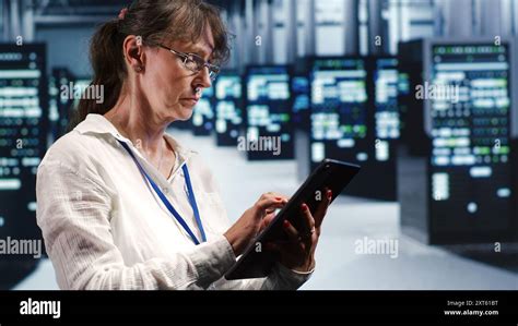 Octogenarian System Administrator Working In Data Center Housing Gpu