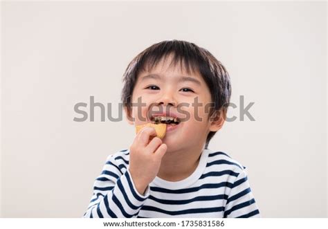 Handsome Asian Boy Eating Cookies Photos And Images Shutterstock