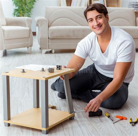 Man Assembling Furniture At Home Stock Image Image Of Fasten Equipment