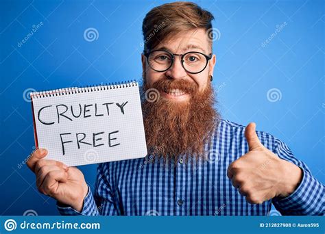 Redhead Irish Man With Beard Doing Housework Laundry Over Yellow