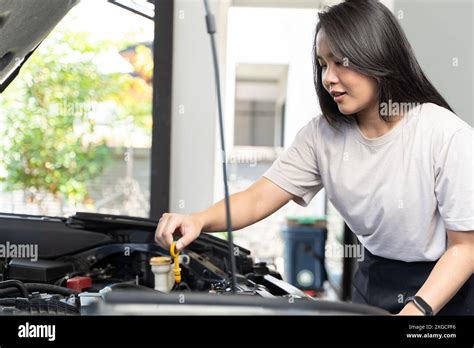 Asian Driver Woman Checking Car Radiator Problems Female Checks Break Down Vehicle Engine