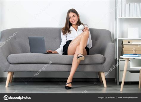 Beautiful Secretary With Sexy Legs Sit On Sofa In Office Sexy Business