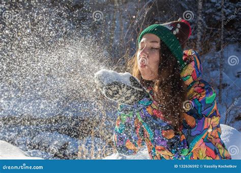 Beauty Winter Girl Blowing Snow In Frosty Winter Park Outdoors Flying