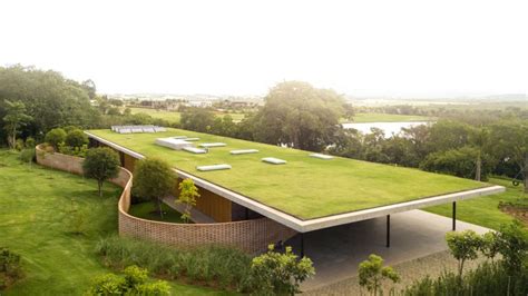 Monumental Grassy Roof Covers Planar House In Brazil By Studio MK27