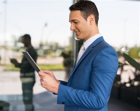 premium photo businessman using his tablet