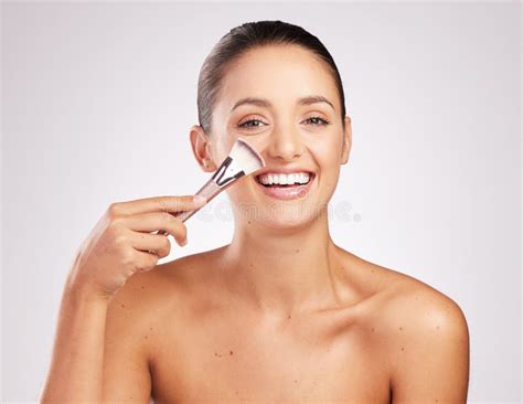 Woman Brush And Foundation In Studio Portrait Makeover And Makeup