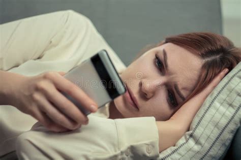 The Girl Is Doomscrolling Sitting With A Phone In Her Hands A Concentrated Look An Expression